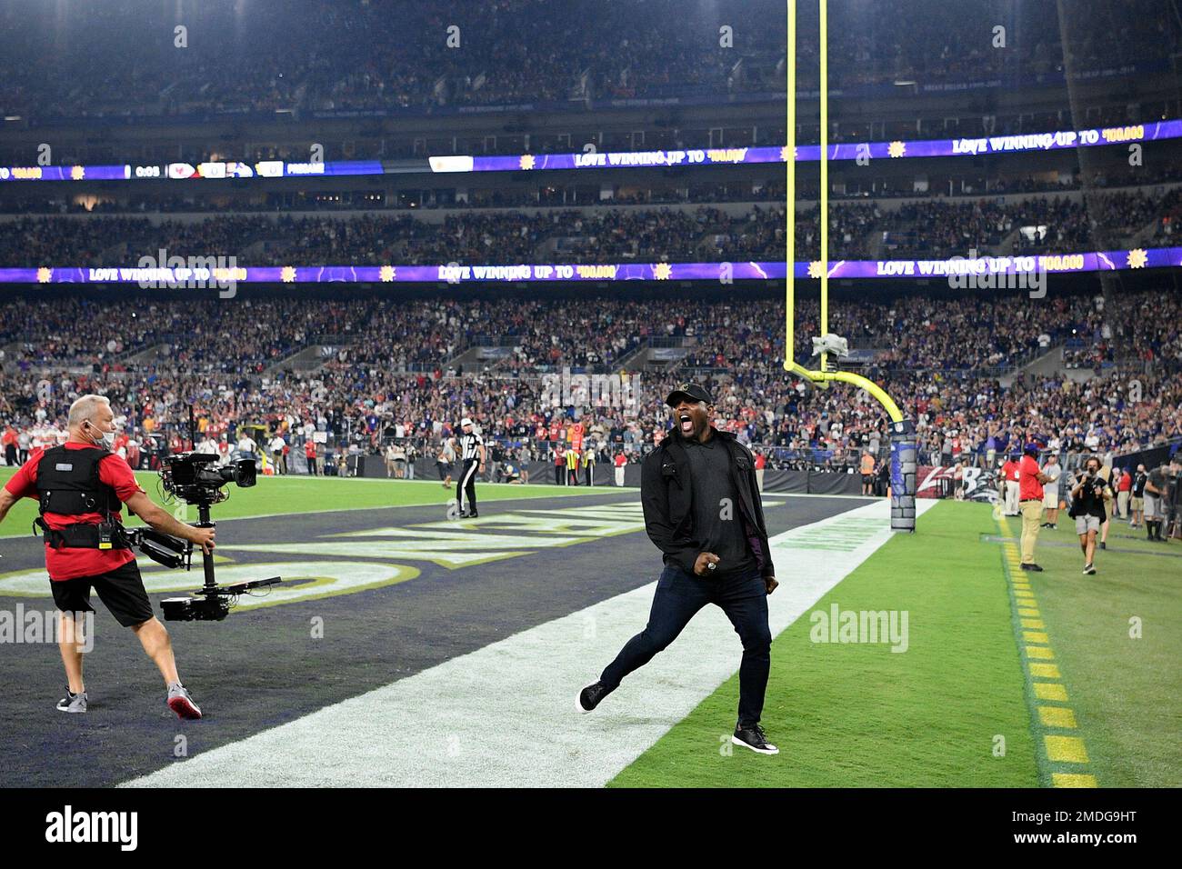 Former Baltimore Raven Ray Lewis walks on the field before an NFL ...