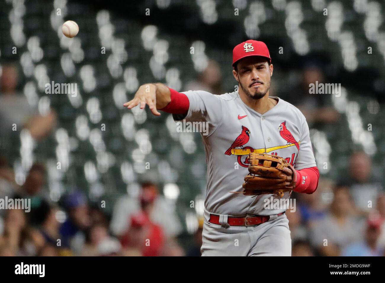 St. Louis Cardinals' Nolan Arenado throws a runner out at first during ...