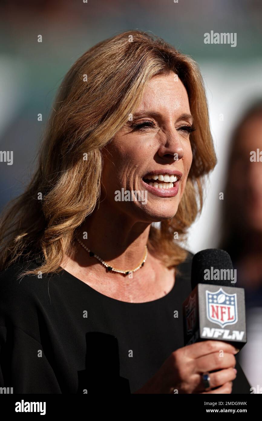 Reporter Kim Jones works on the sidelines after an NFL football game ...