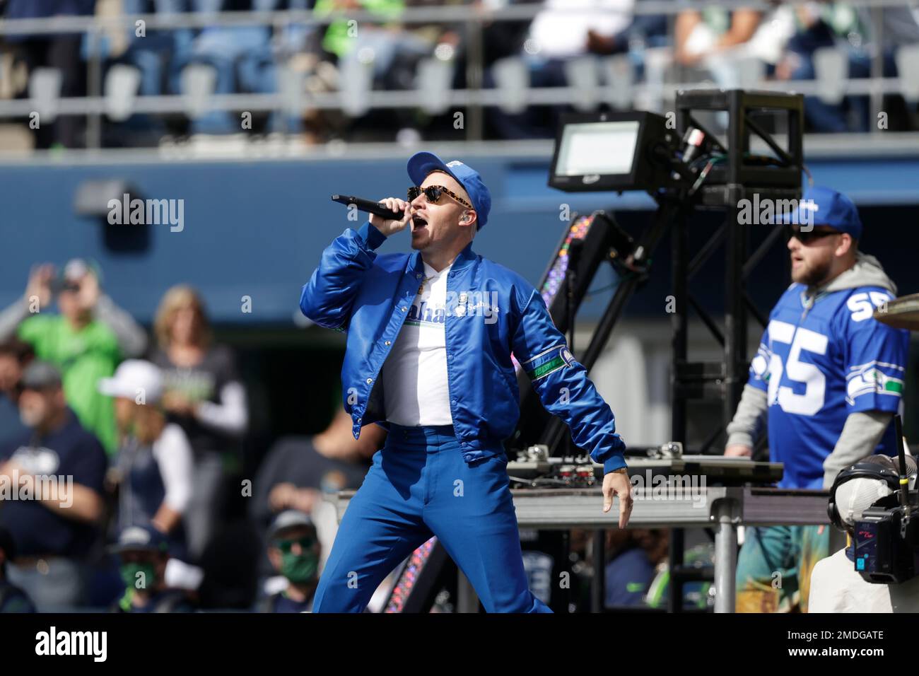 Rap singer Macklemore performs before an NFL football game between the ...