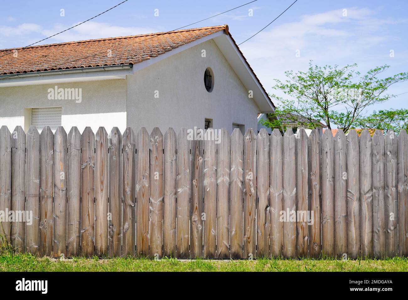 home palisade wooden fence to hide the neighbor from house Stock Photo ...