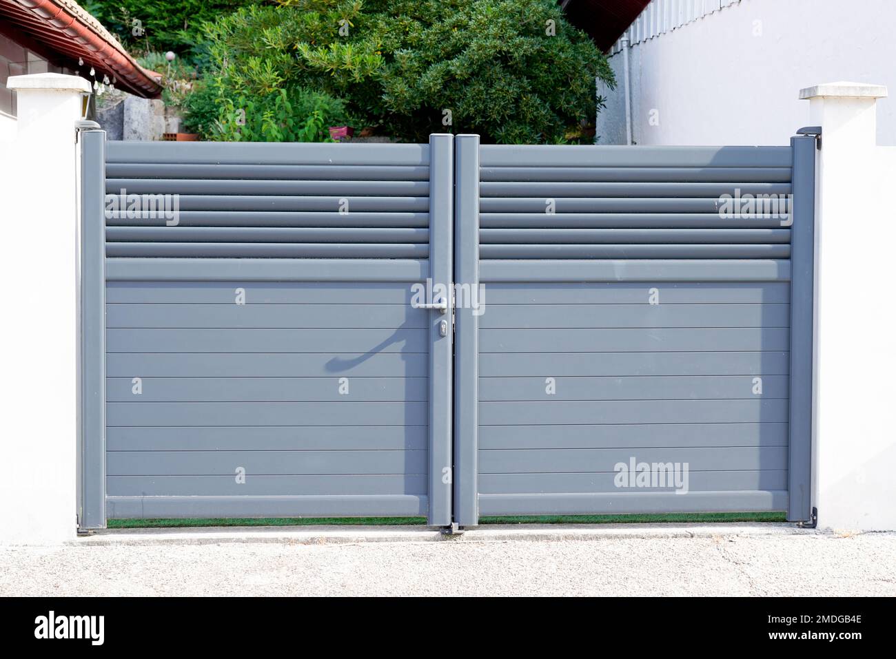 grey gate aluminum portal home door of suburbs house in street Stock ...