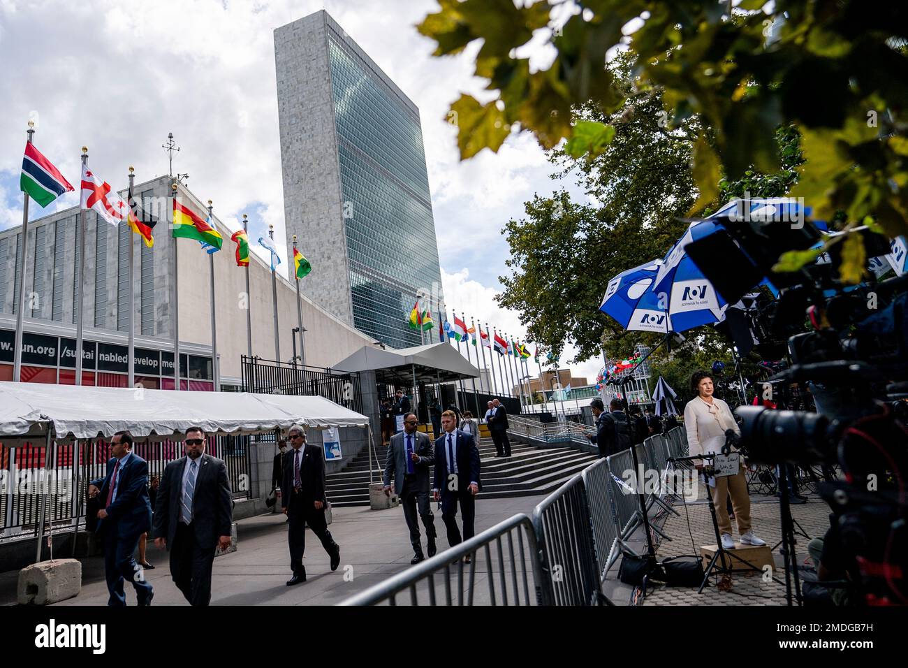 News media sets up outside the United Nations headquarters as staff and ...