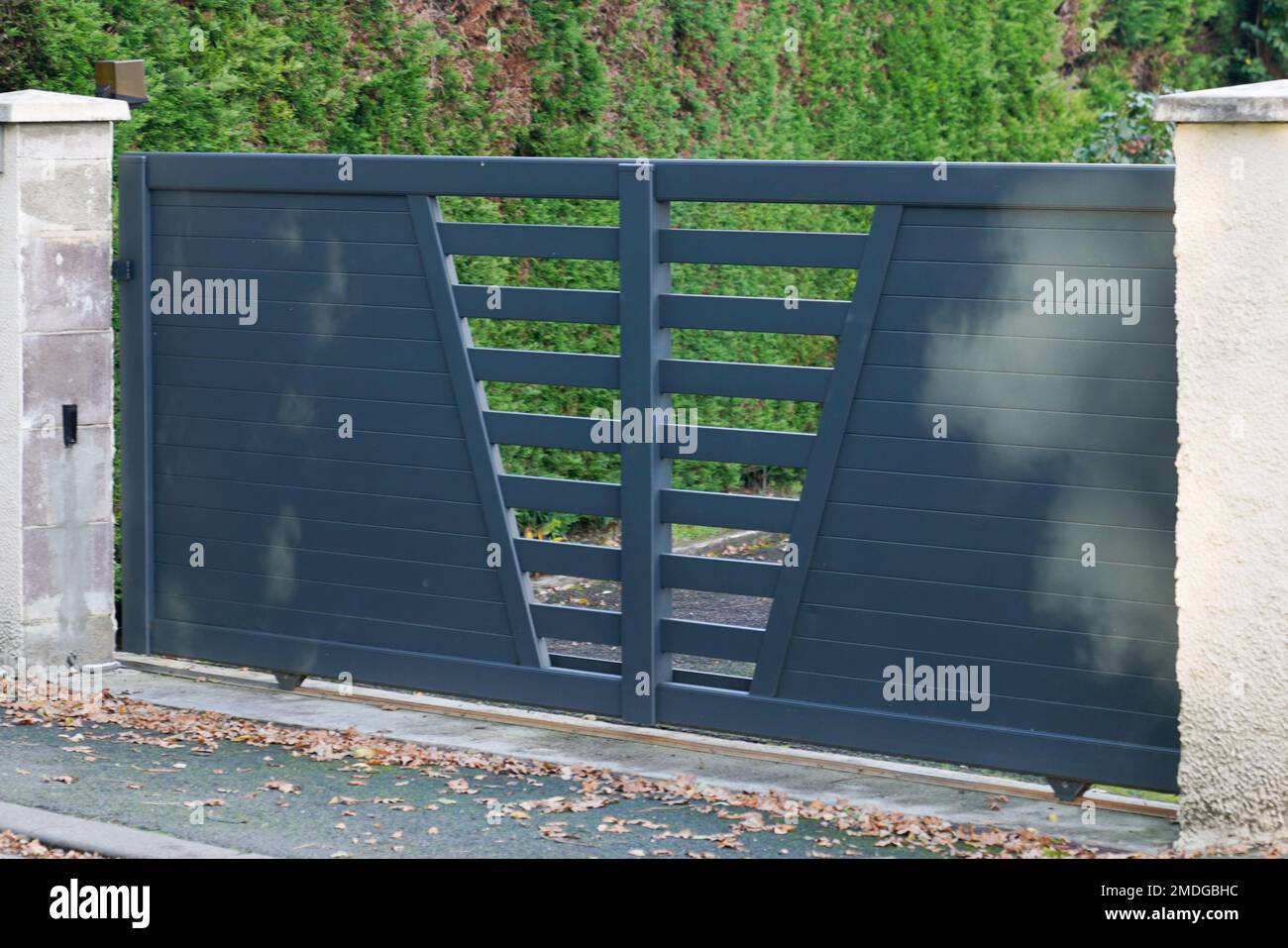 Aluminum gray sliding portal of suburb house Stock Photo - Alamy