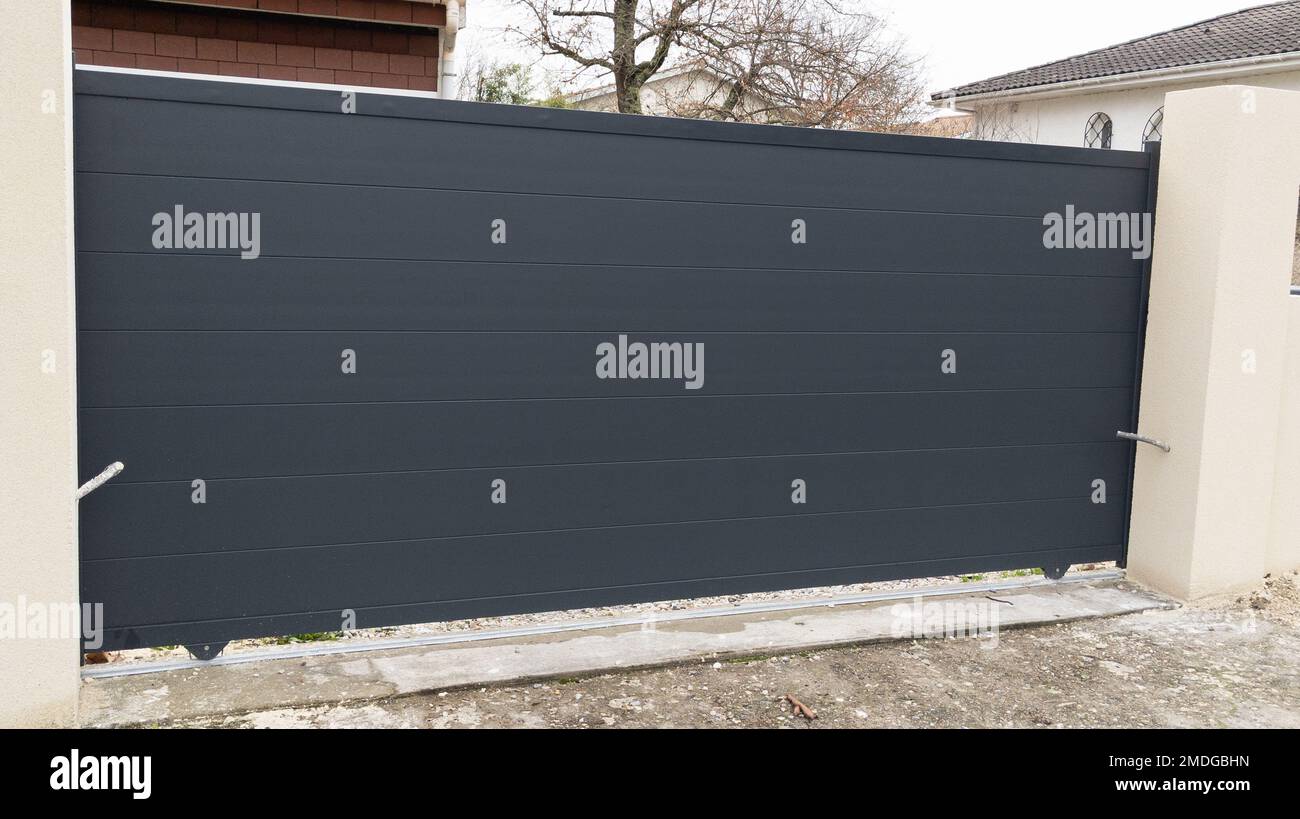 grey dark home steel sliding door aluminum gate slats Stock Photo - Alamy