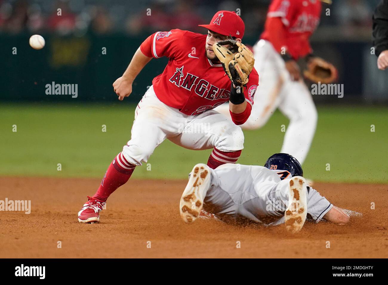 Houston Astros' Chas McCormick, bottom, steals second base as Los ...