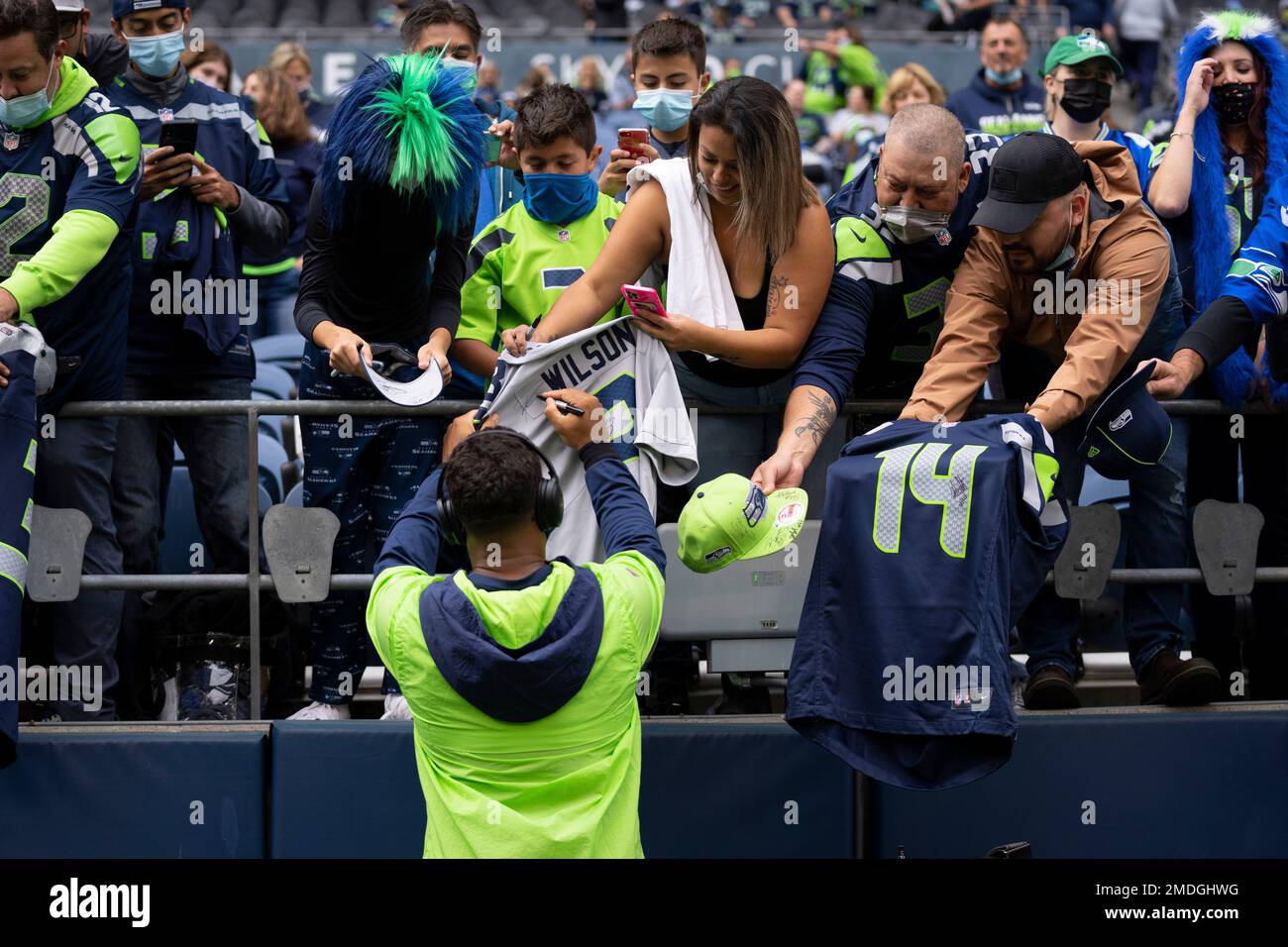 Seattle Seahawks quarterback Russell Wilson (3) signs autographs pre ...