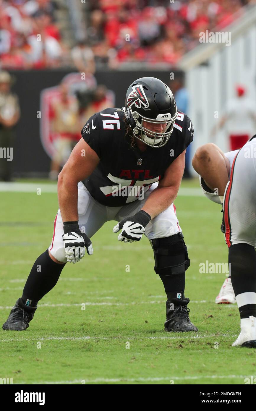 Atlanta Falcons offensive tackle Kaleb McGary (76) sets himself against ...