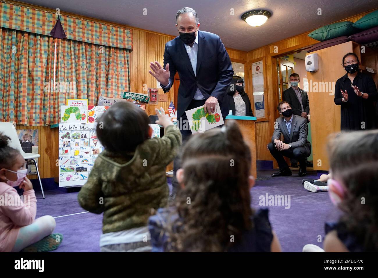 Douglas Emhoff, husband of Vice President Kamala Harris, top, greets ...