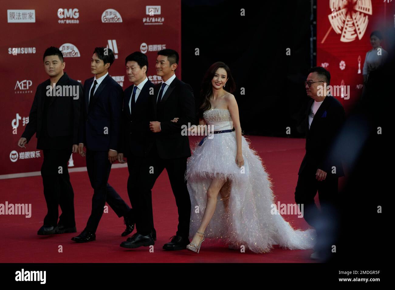 Actress Tong Liya walk in with the crew and cast of the movie Flashover ...