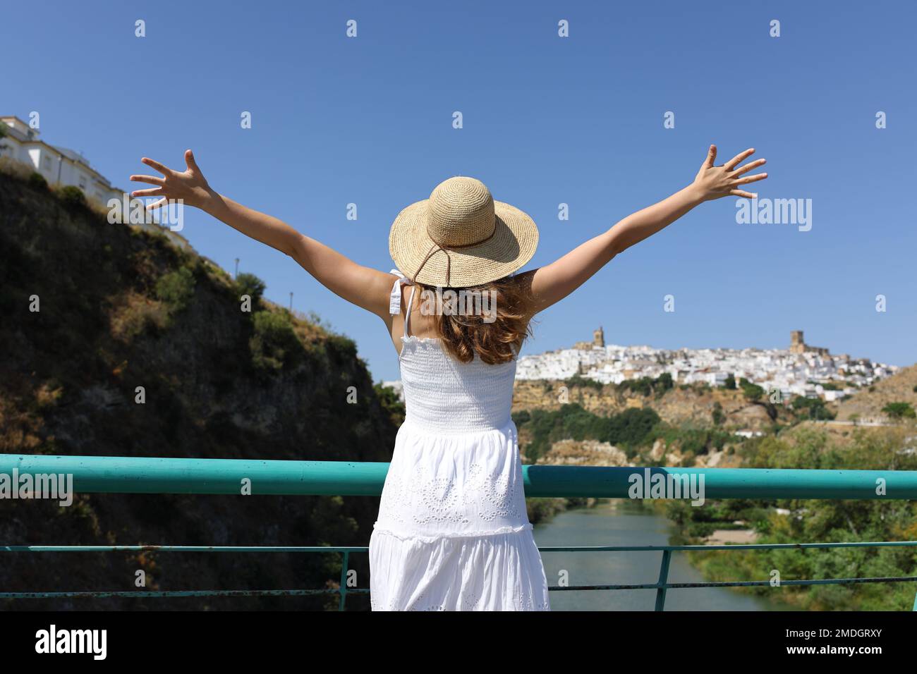 Back view of a happy tourist celebrating vacation outdoors Stock Photo ...