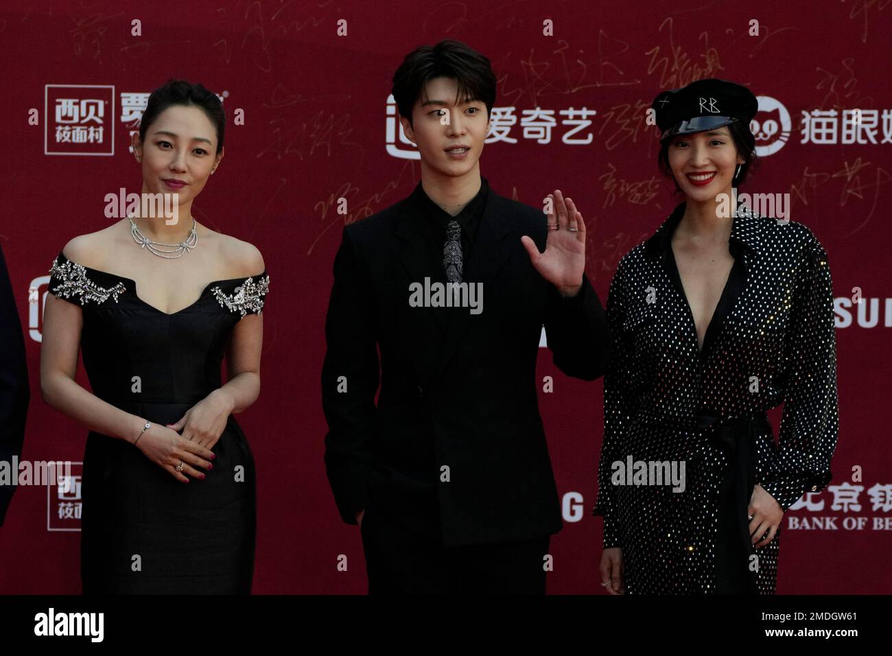 From left; actress Bai Baihe, actor Fan Chengcheng and actress Wang Zhixuan attend the red ...