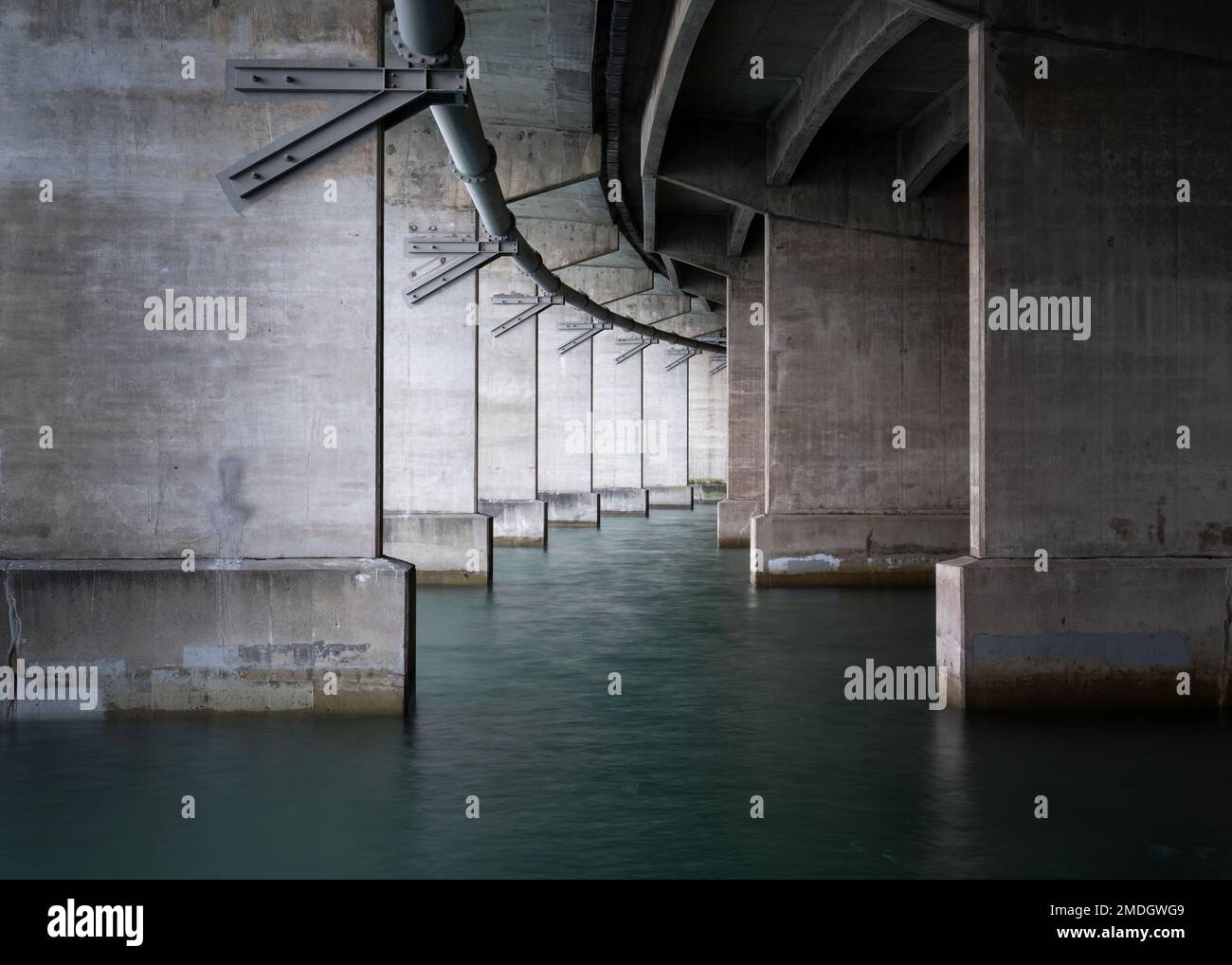 Concrete pillars and pipes under the Harbour Bridge. Auckland Stock ...