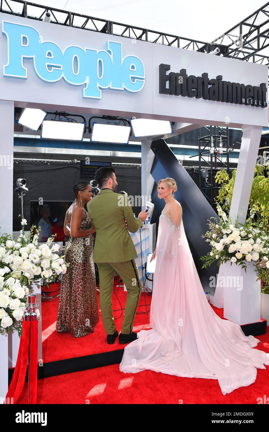 Janine Rubenstein, from left, Jeremy Parsons, and Beth Behrs arrive at ...
