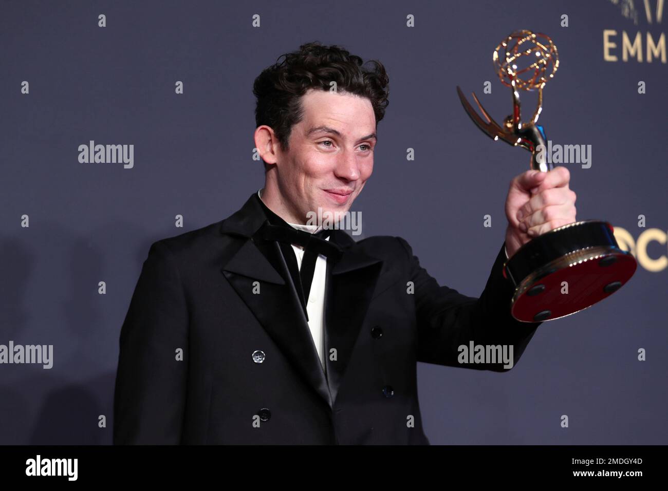 Josh O'Connor poses for a photo with the award for outstanding lead ...