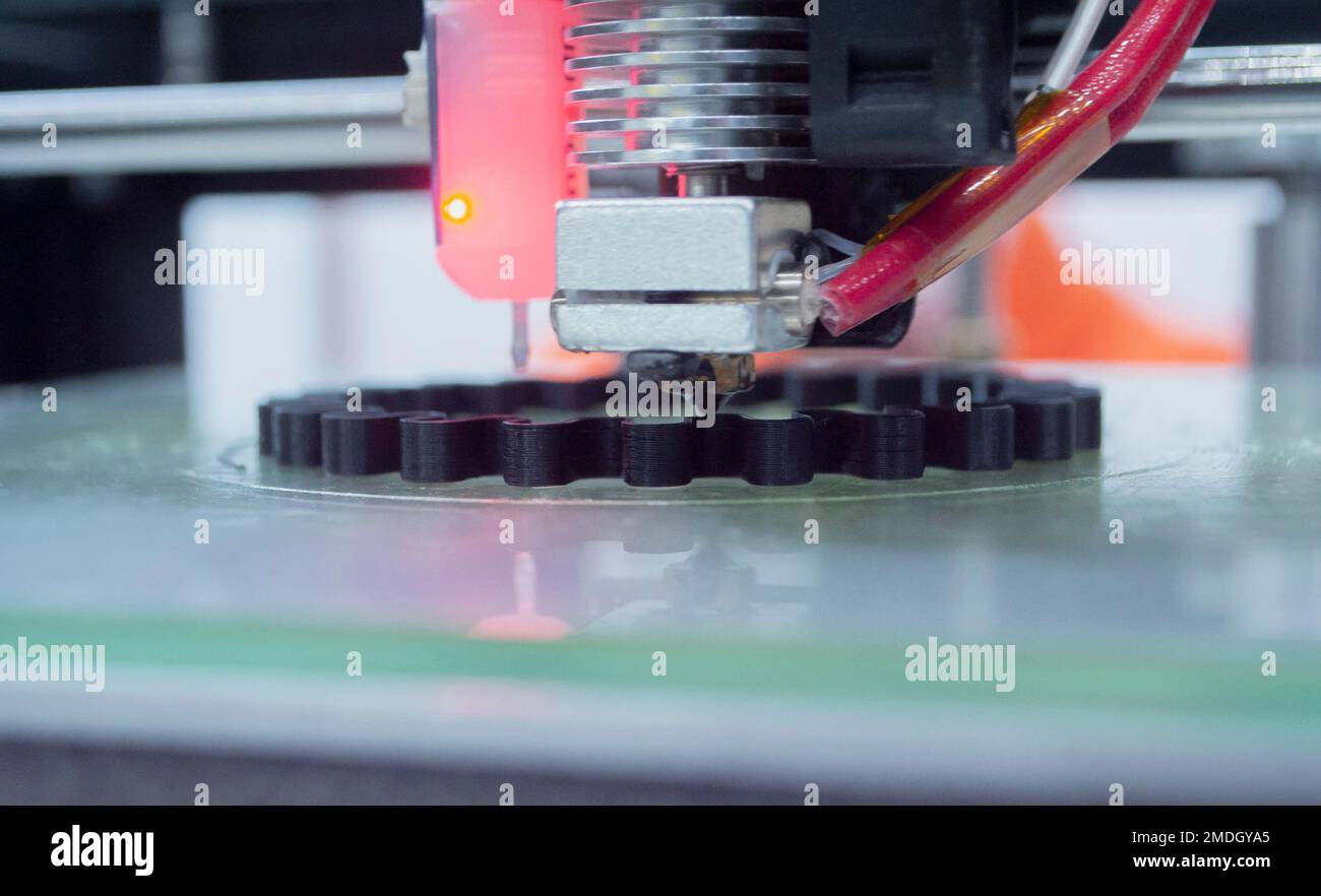 3d printer printing a model close-up. The process of printing a model ...