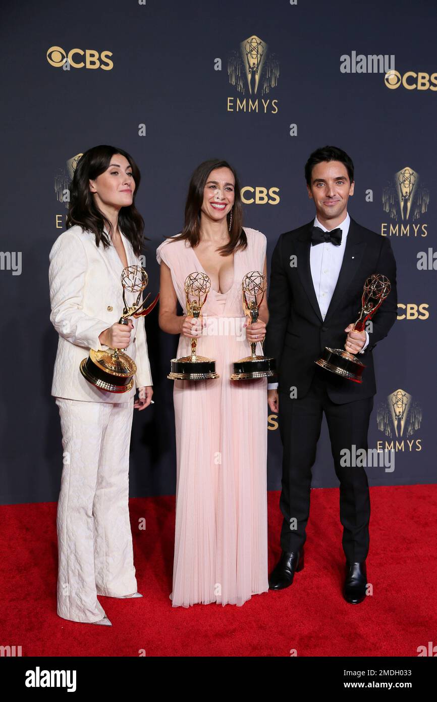 Jen Statsky, from left, Lucia Aniello, and Paul W. Downs pose for a photo with the awards for ...