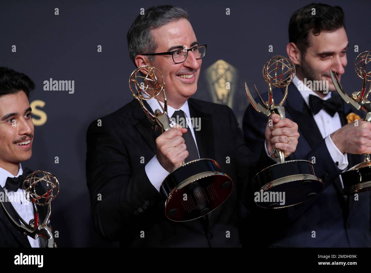 Mark Kramer, from left, John Oliver, and Christopher Werner pose for a ...