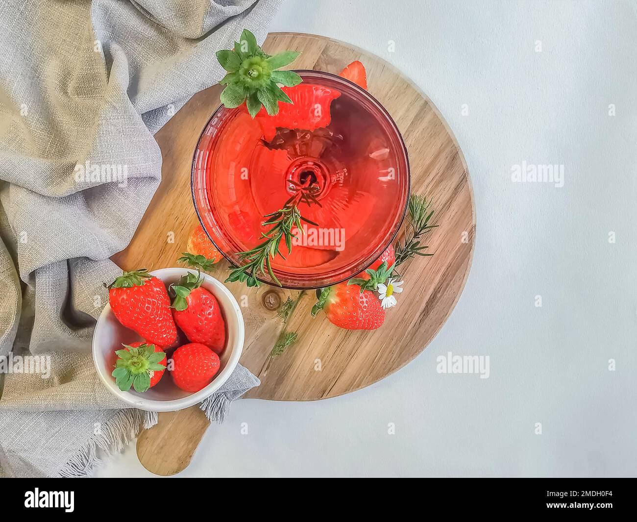 Whole red strawberries on white base hi-res stock photography and ...