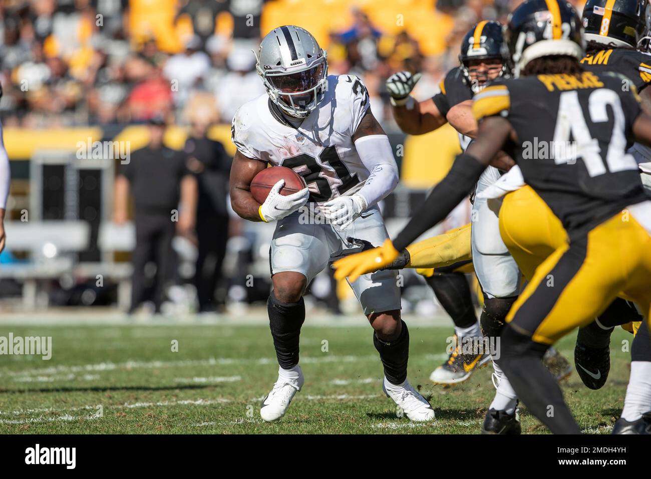 Las Vegas Raiders running back Peyton Barber (31) rushes during an NFL ...
