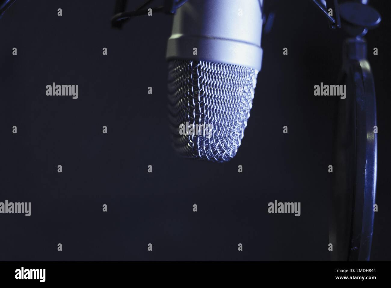 Professional microphone suspended in the air of professional studio ...