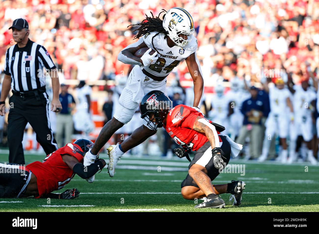 Florida International's D'vonte Price (24) jumps over Texas Tech's ...
