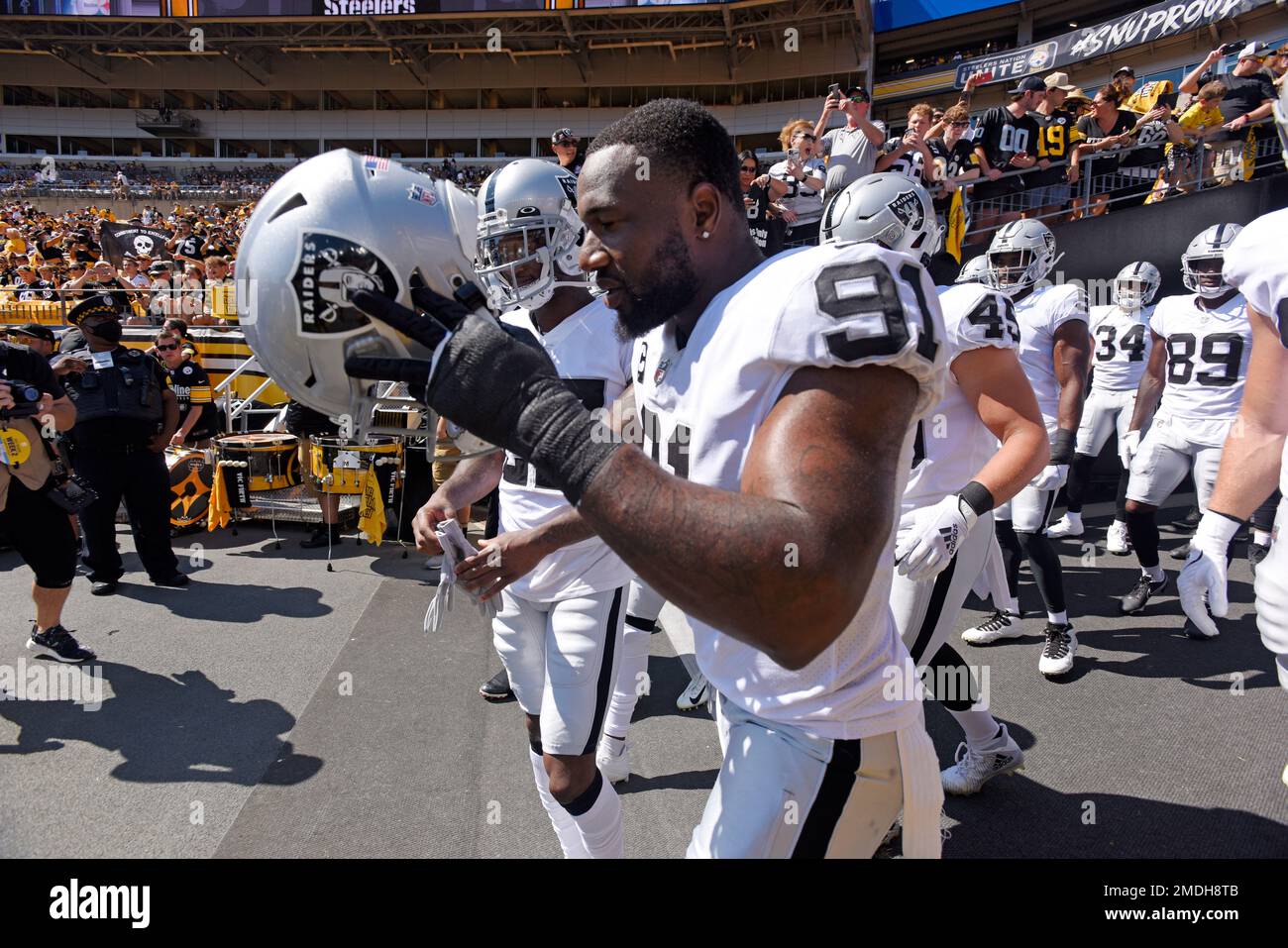 Las Vegas Raiders defensive end Yannick Ngakoue (91) takes the field for an NFL football game ...