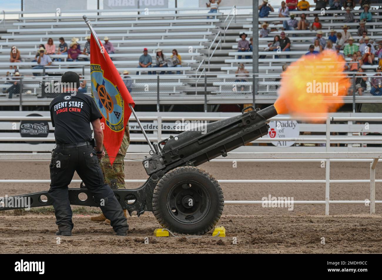 A Cheyenne Frontier Days staff member fires a cannon during CFD opening ...