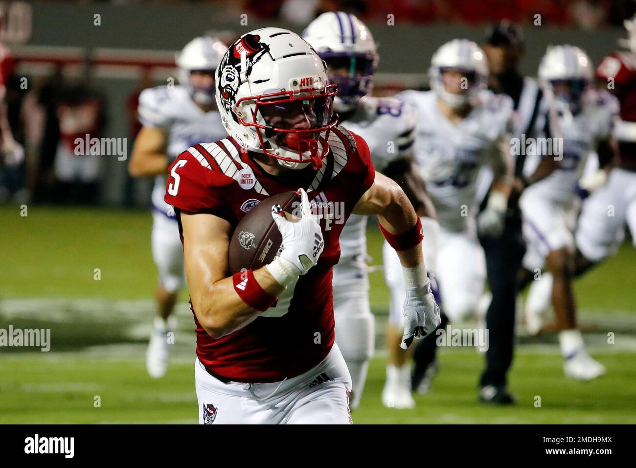 North Carolina State's Thayer Thomas (5) runs the ball against Furman ...