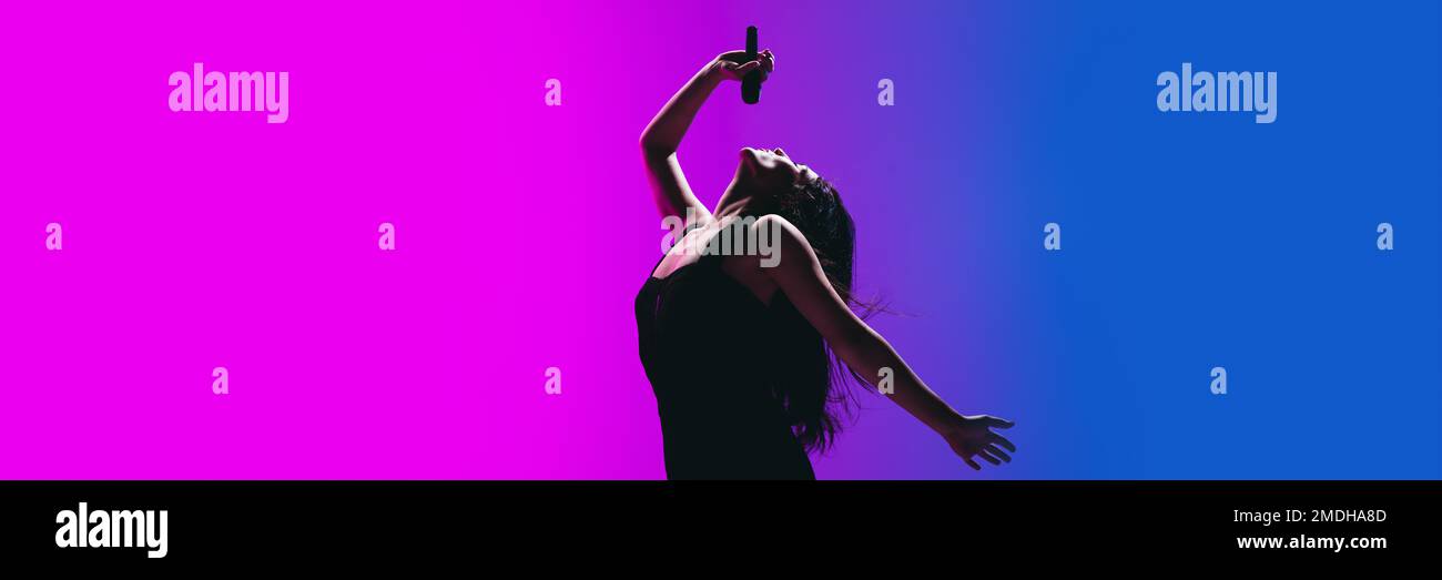 Singer. Horizontal banner with portrait of young emotinal woman posing ...