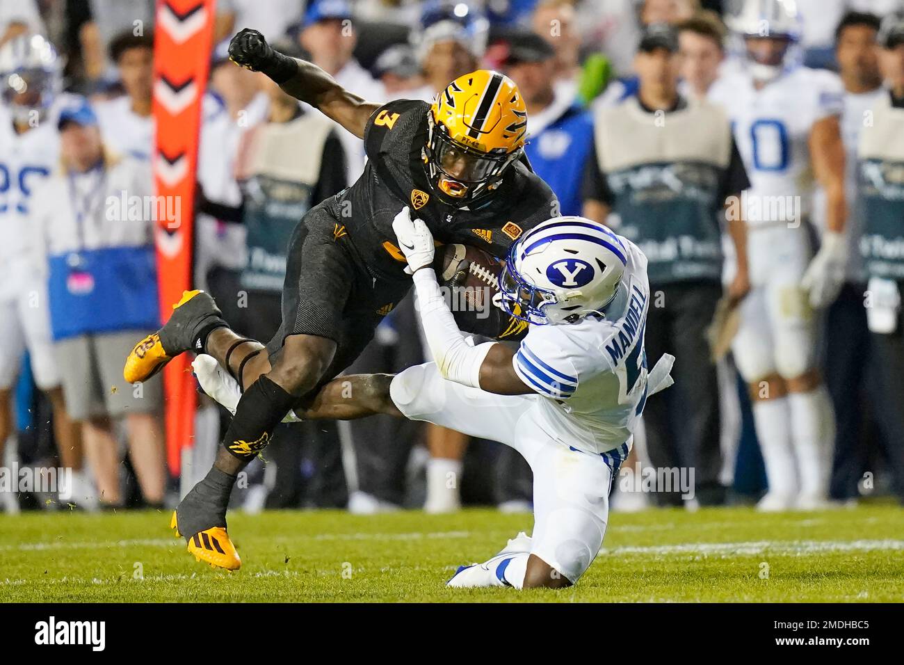 BYU defensive back D'Angelo Mandell (5) tackles Arizona State running ...