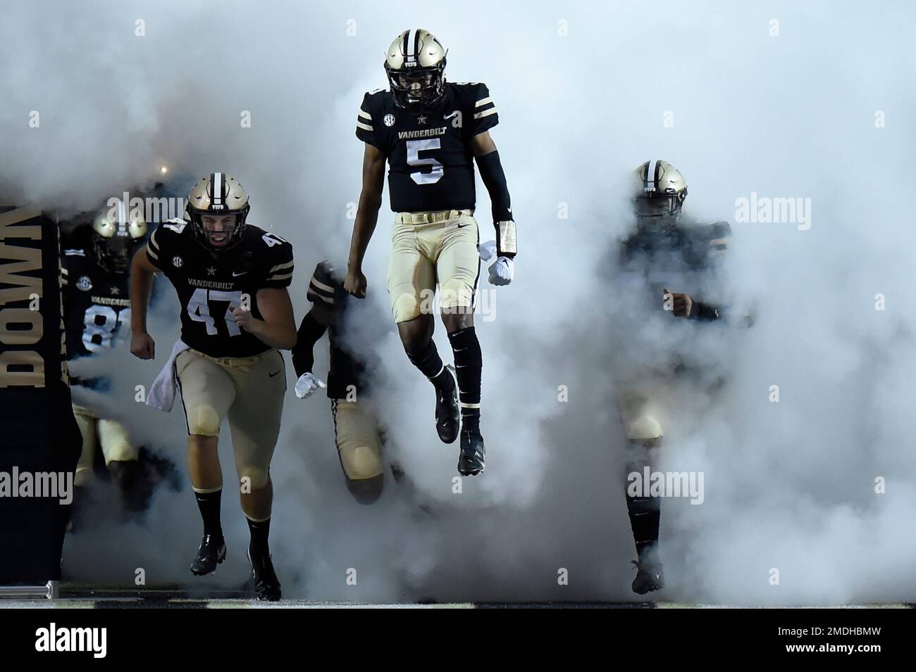 Vanderbilt quarterback Mike Wright (5) runs onto the field with ...