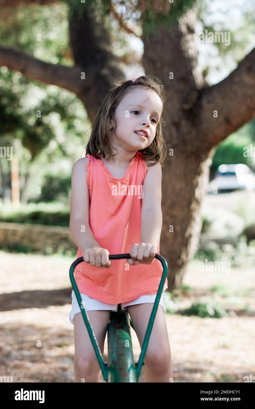 Girls on playground equipment smiling hi-res stock photography and ...