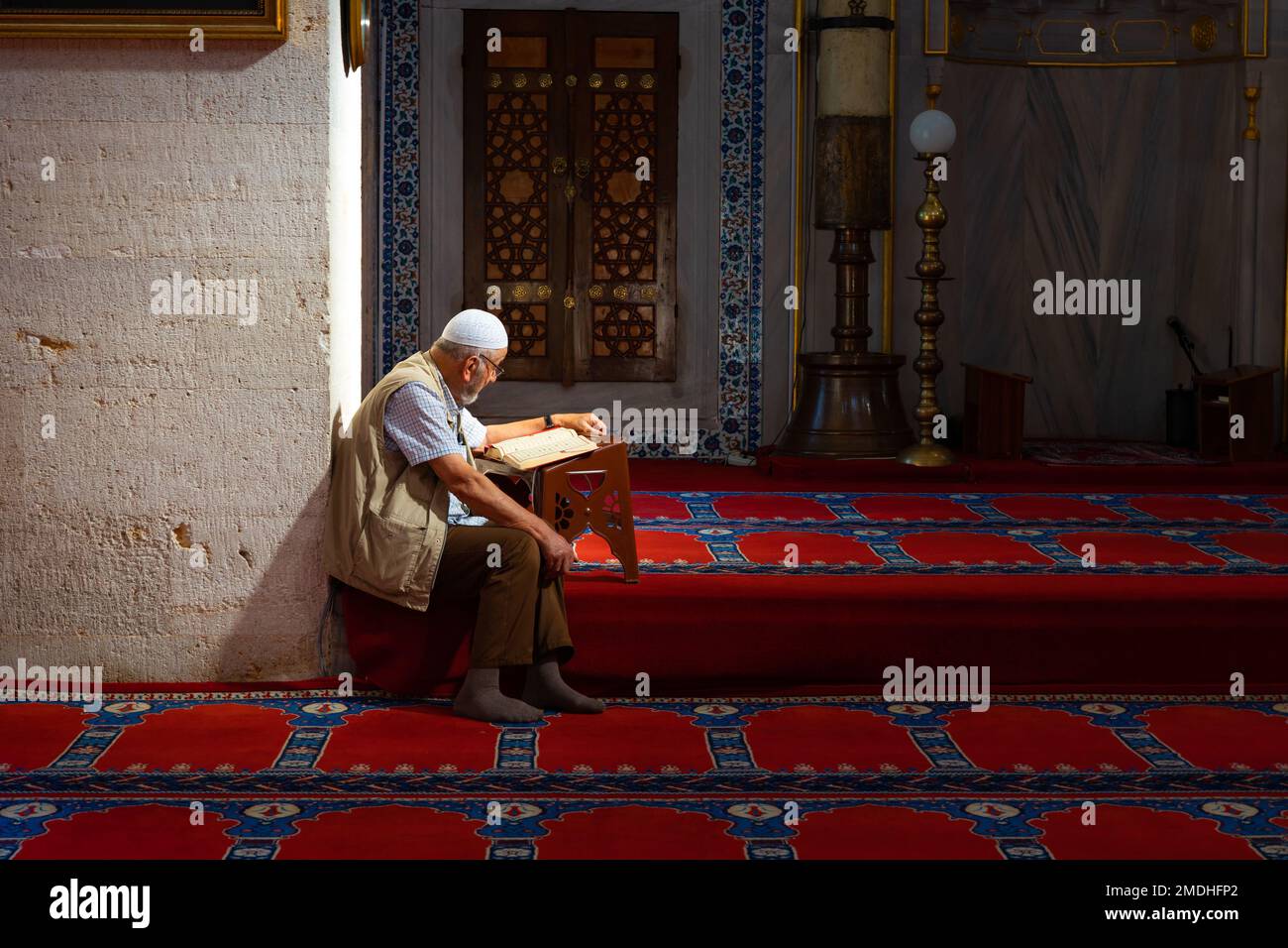 Muslim man reading quran in the mosque hi-res stock photography and ...