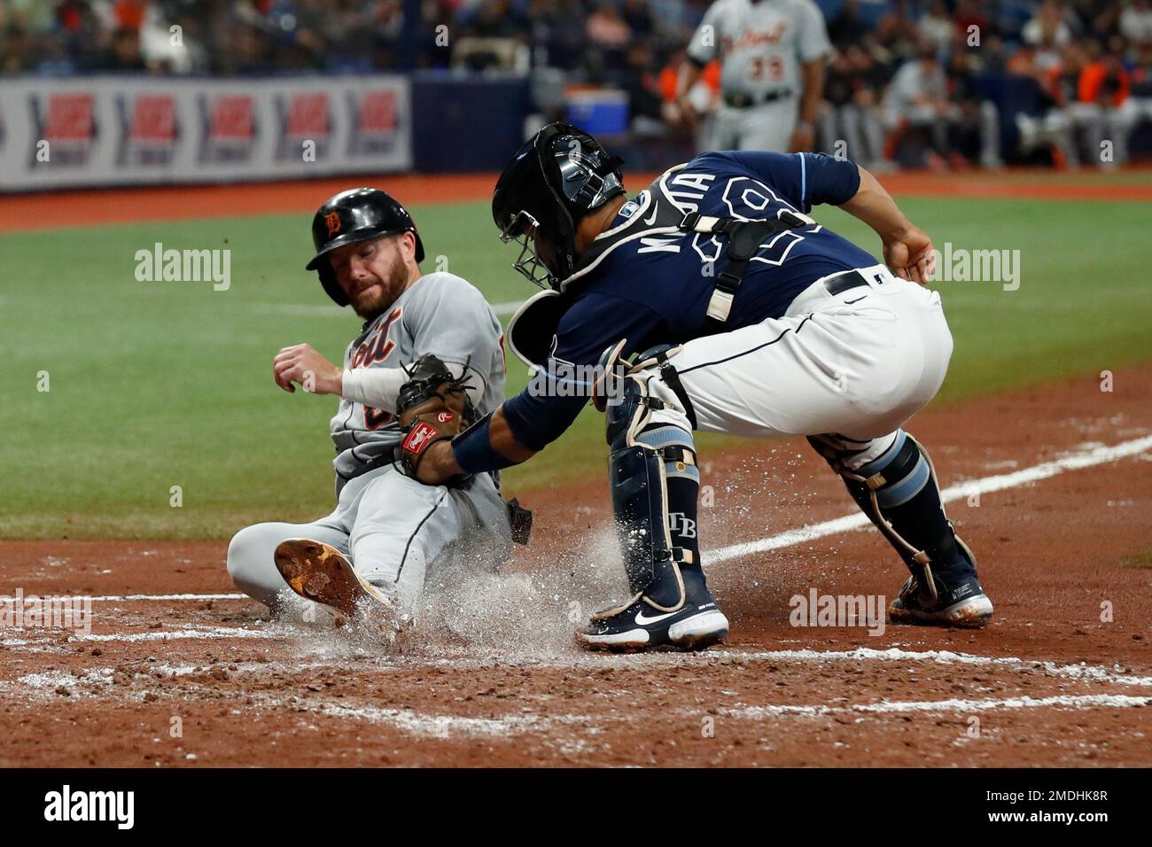 Detroit Tigers' Robbie Grossman, left, beats the tag of Tampa Bay Rays ...
