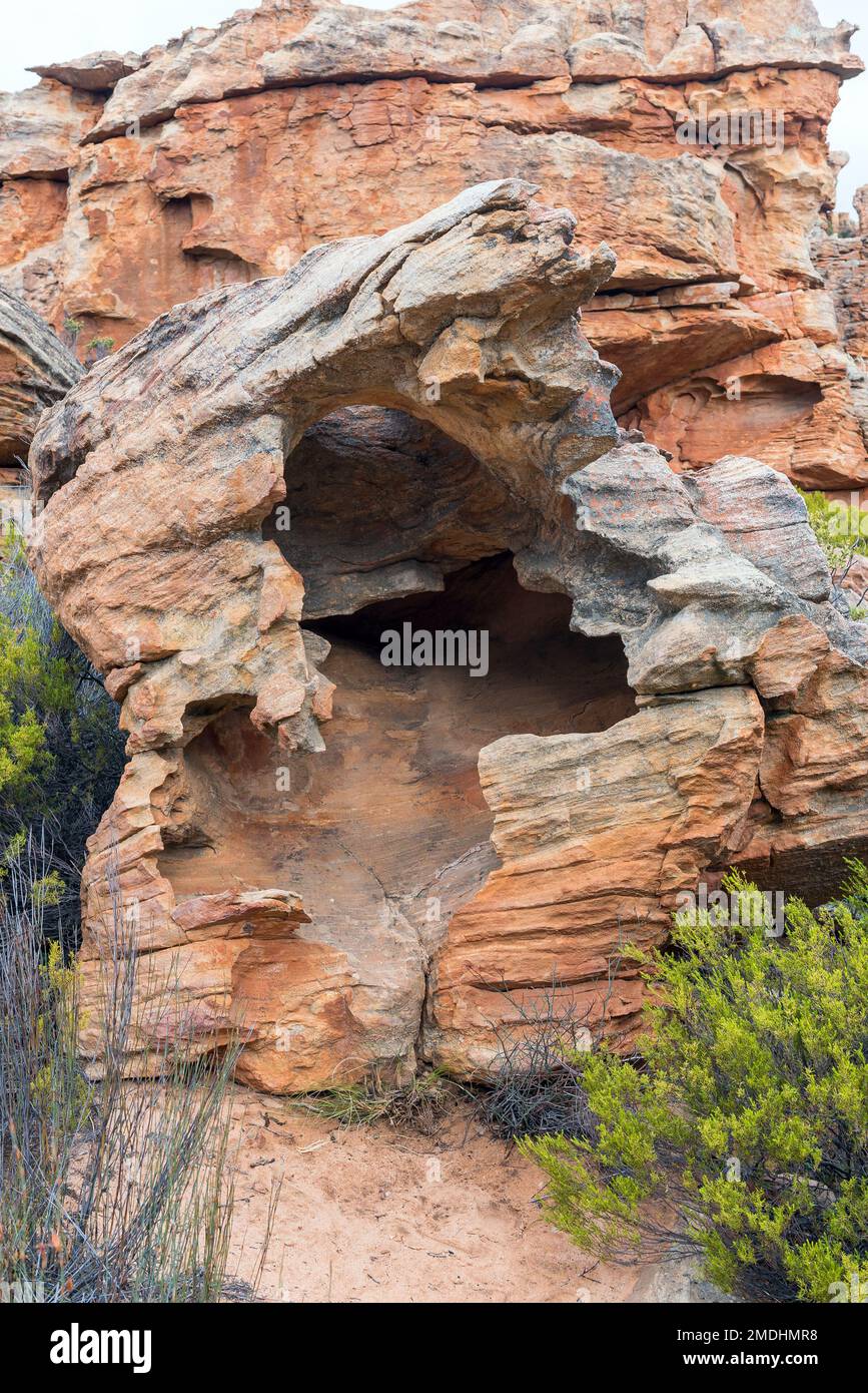 A small sandstone cave, with a hole in the roof, at the Stadsaal Caves ...