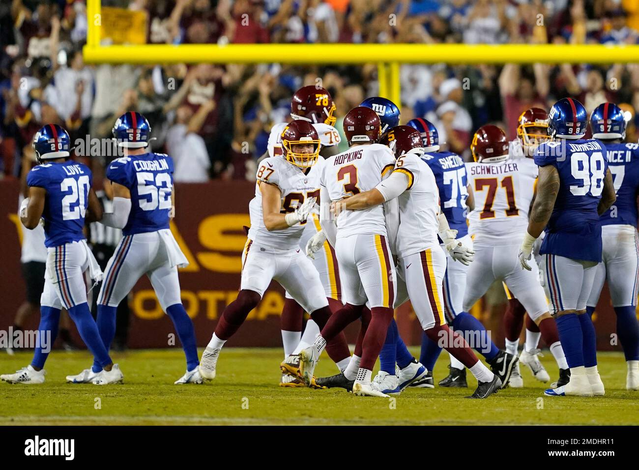 Members of the Washington Football Team celebrate kicker Dustin Hopkins ...