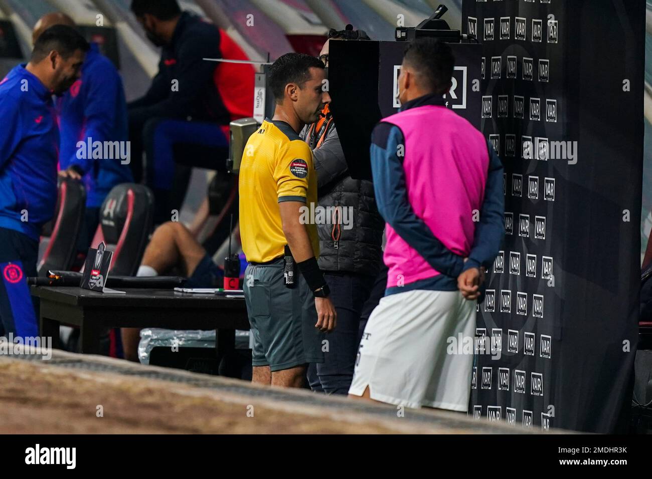Referee Cesar Ramos checks the VAR screen during a CONCACAF Champions ...