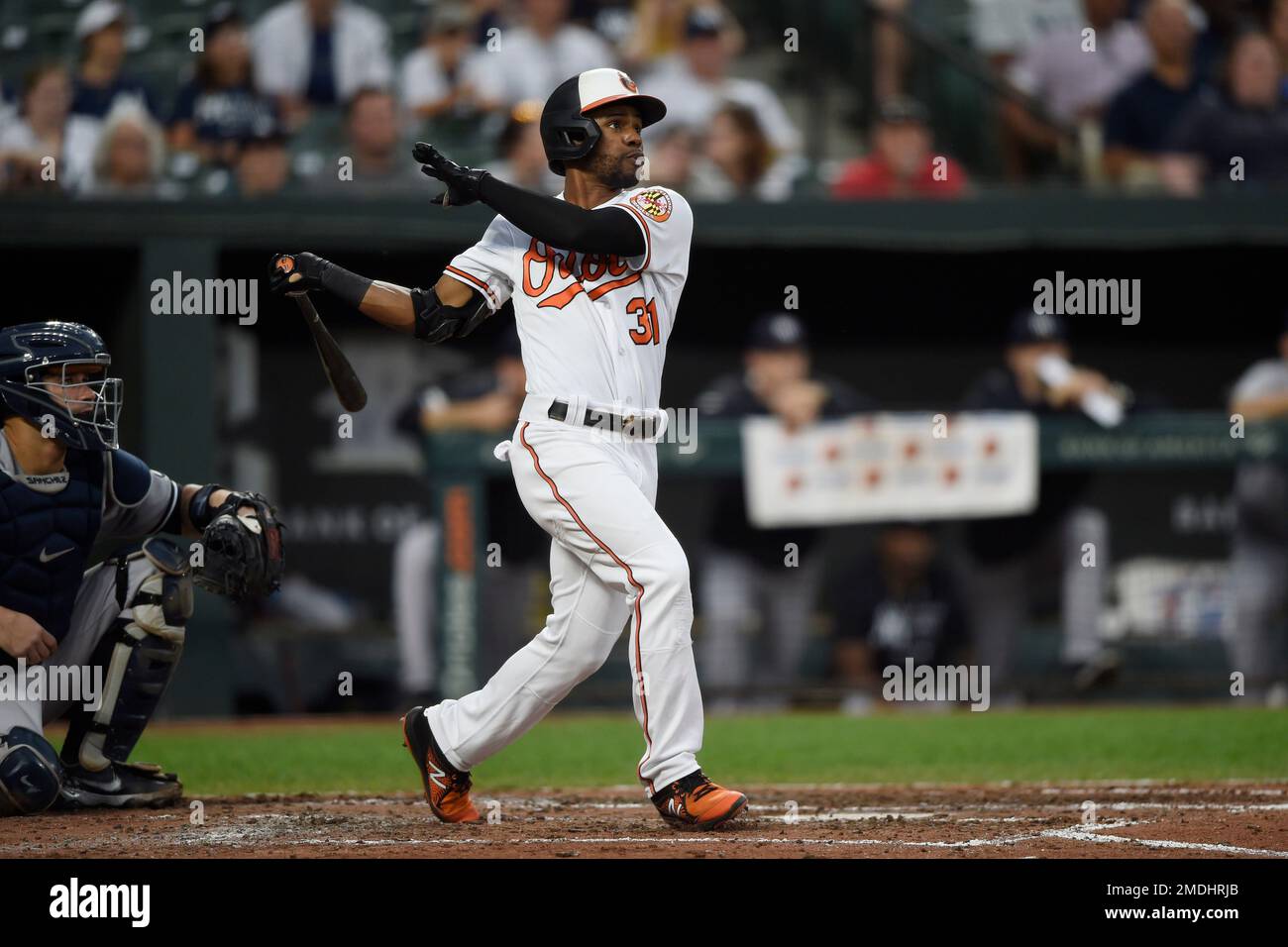 Baltimore Orioles' Cedric Mullins follows through on a single against ...