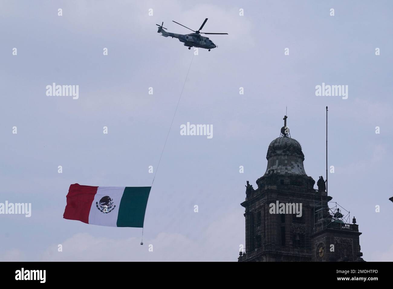 A helicopter fly´s with a Mexican flag as part of Mexico's annual ...