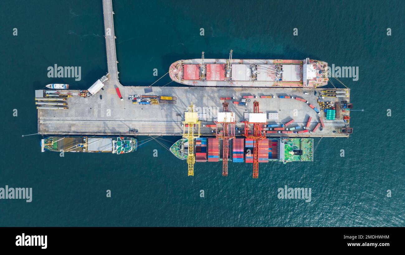 Truck running to Cargo Container Ship at Cargo Sea Port Stock Photo - Alamy