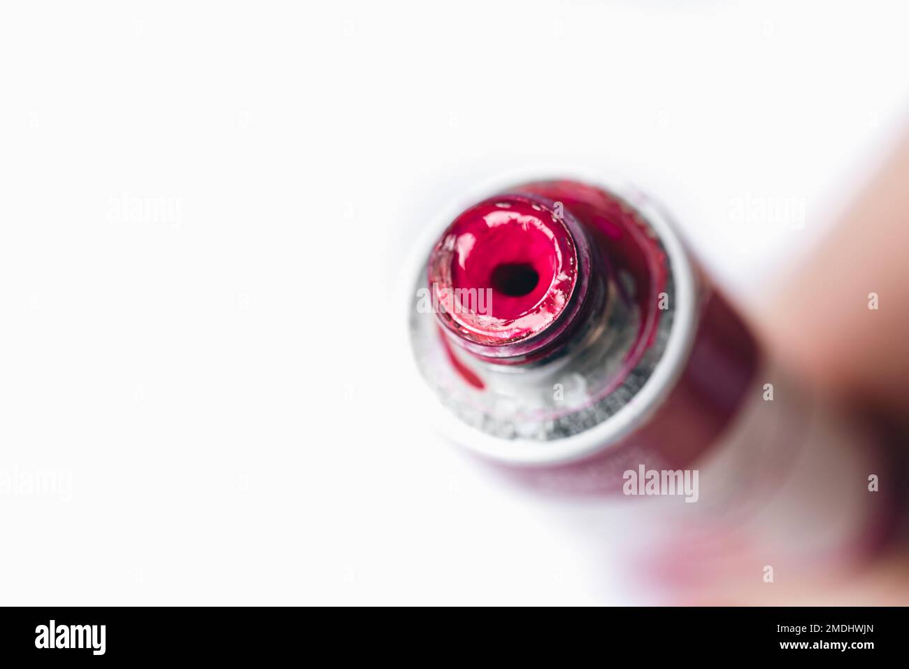 Metal acrylic tube with pink paint for drawing close up on white ...