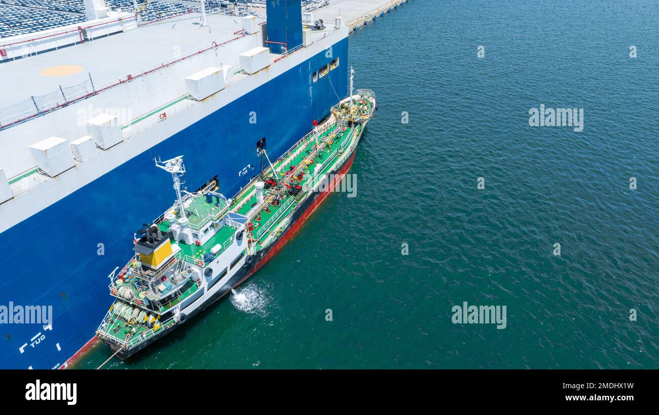Oil ship refueling to Cargo ship at dock, Refueling at sea Oil products ...