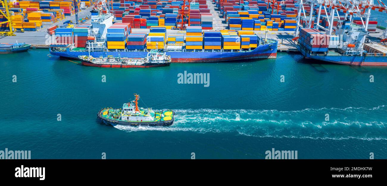 Tug Boat running at Cargo Sea Port. Tug Boat running near container ...