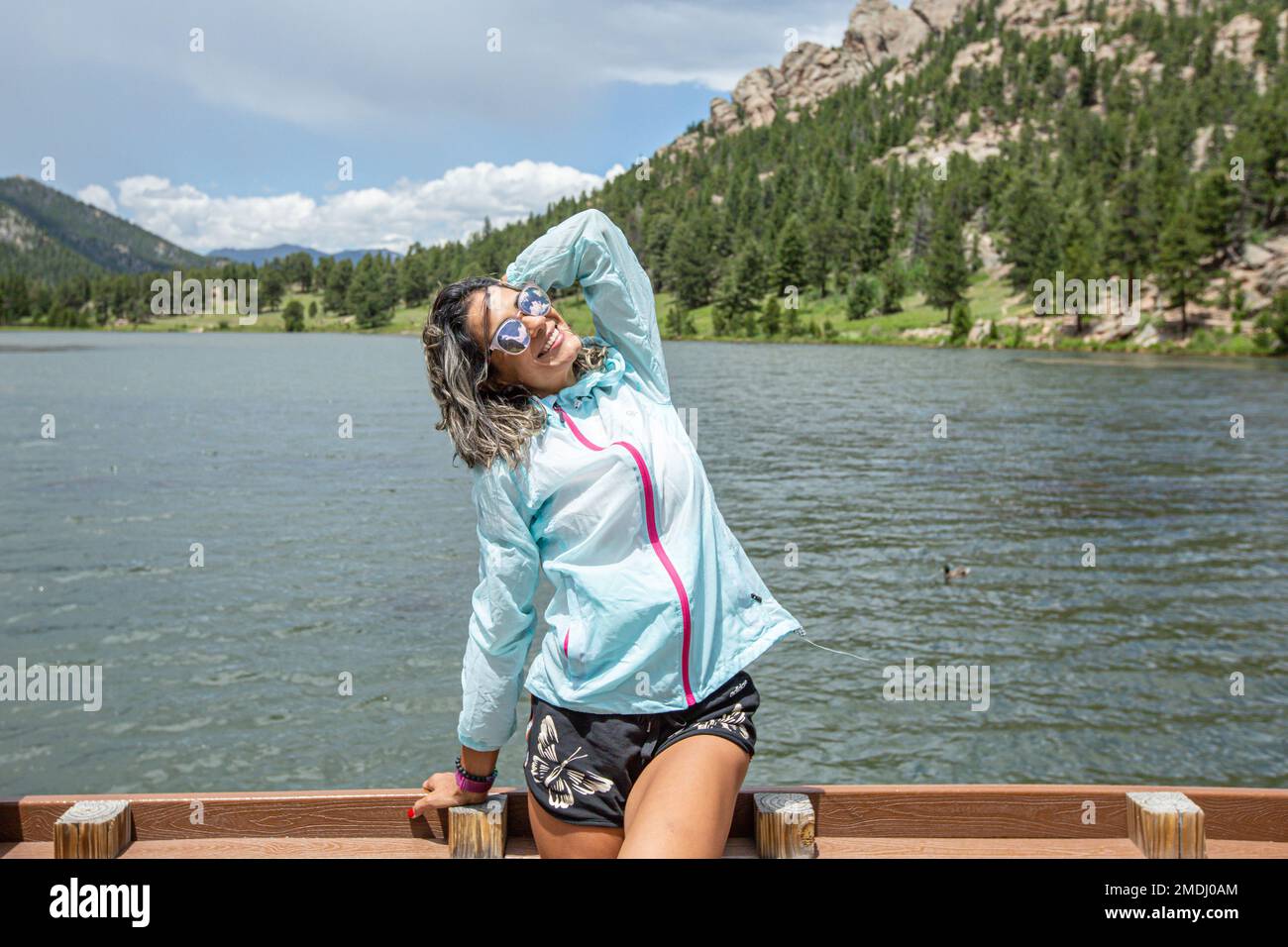 Beautiful young model, poses for the camera, lakeside at Rocky Mountain ...