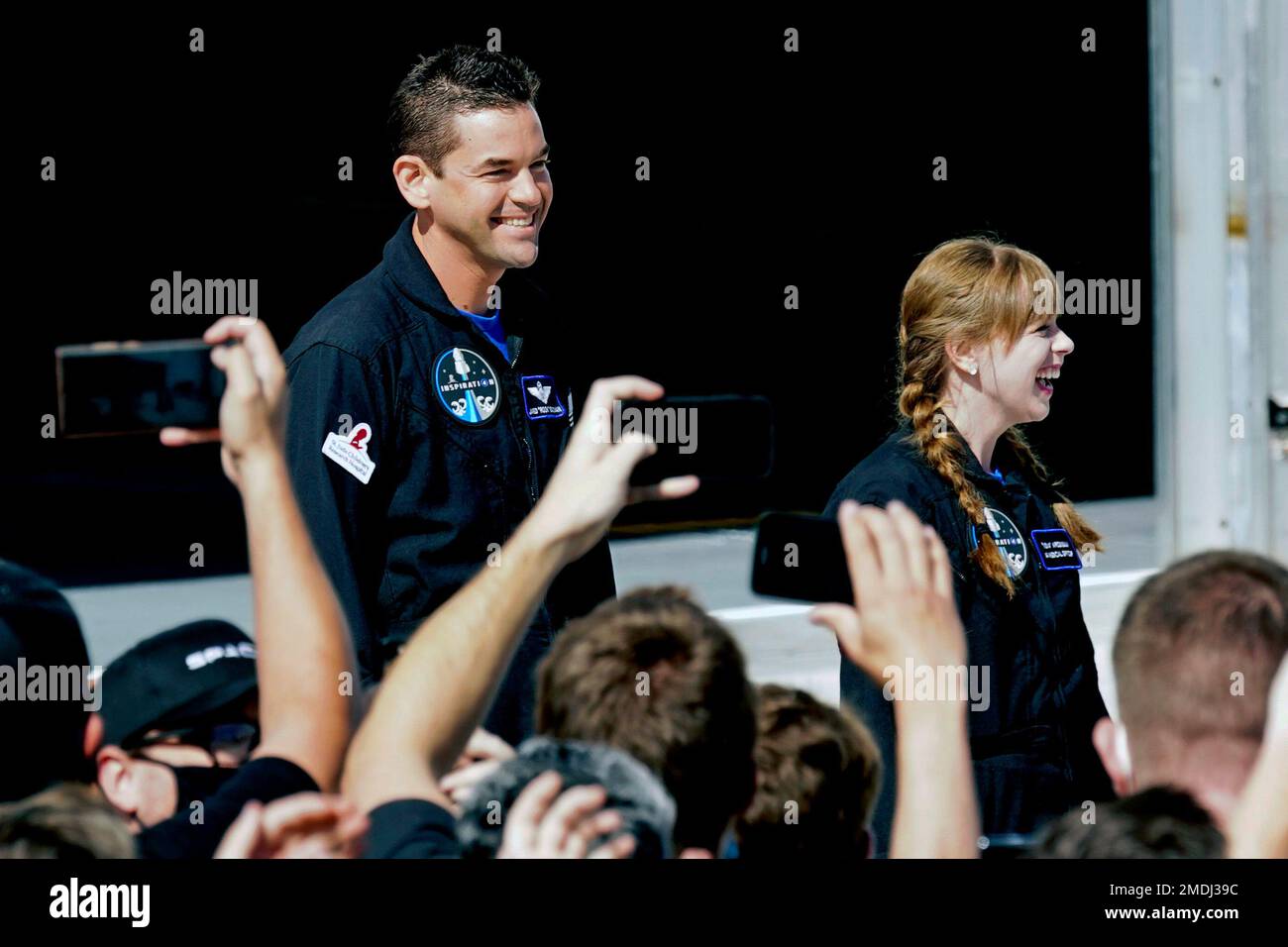 Jared Isaacman, left, and Hayley Arceneaux prepare to head to launchpad ...