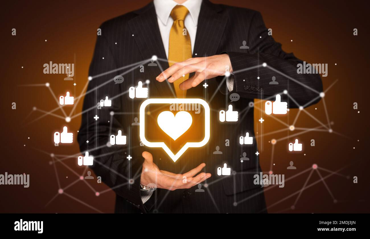 Hand holding social media icons Stock Photo - Alamy
