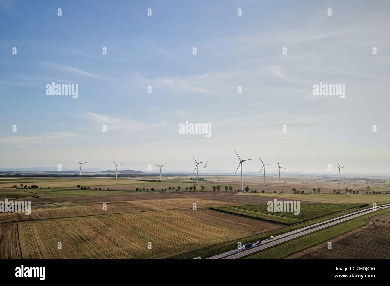 Aerial view of windmill turbine generator against beautiful sky in ...