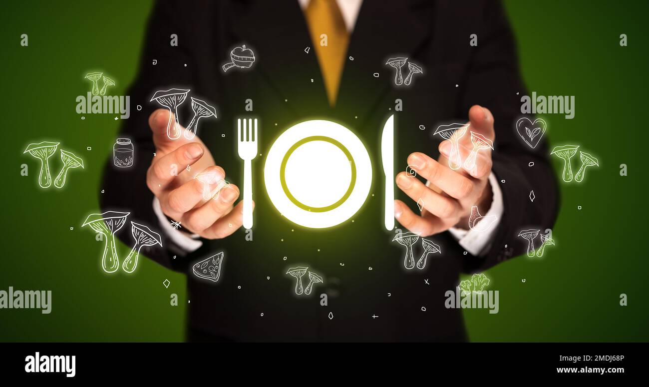 Hand holding food related icons Stock Photo - Alamy