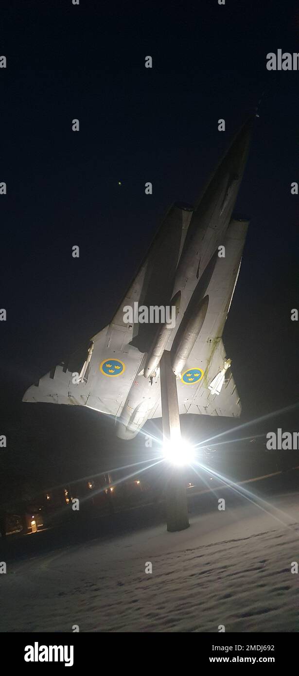A vertical shot of a rocket flying in the air at night Stock Photo - Alamy